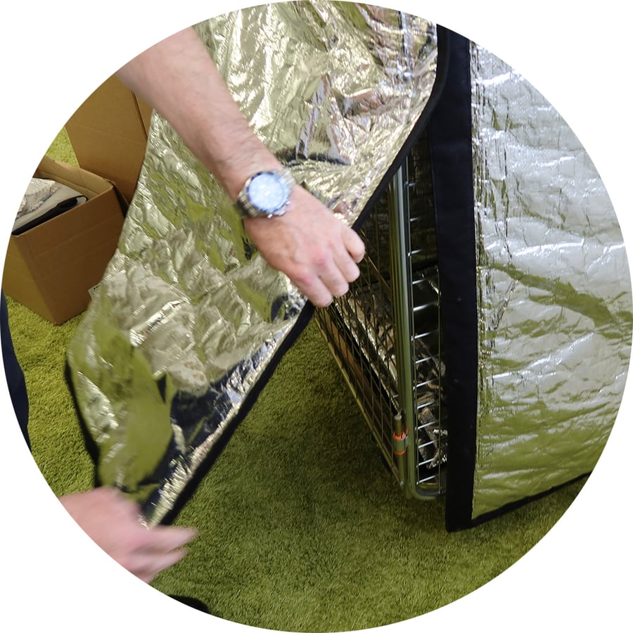How can a foil pallet cover protect goods from temperature spikes?
